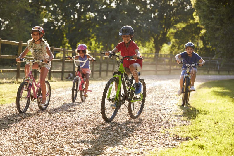 Four Children on Cycle Ride in Countryside Together Stock Image - Image ...