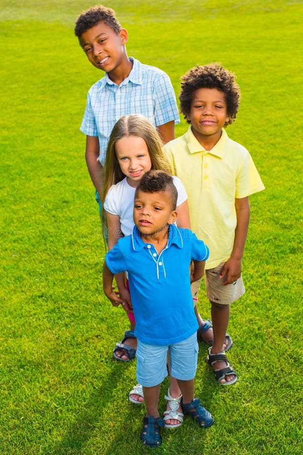 Four smiling children. stock photo. Image of company - 56154470