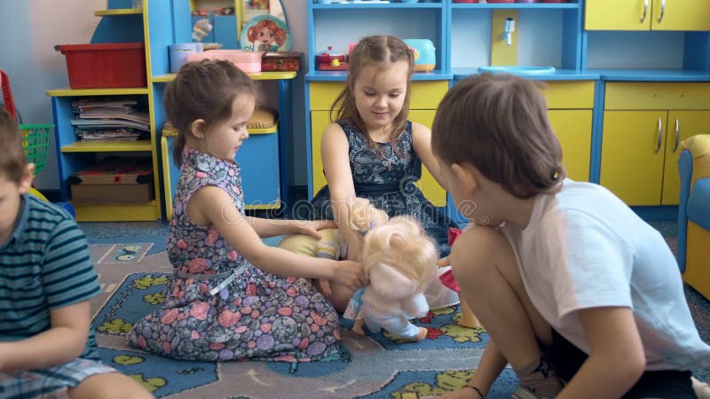 Four Children are Playing on the Floor with Toys Stock Video - Video of ...