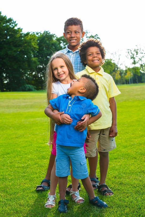 Four Children are Playing on the Glade. Stock Photo - Image of child ...