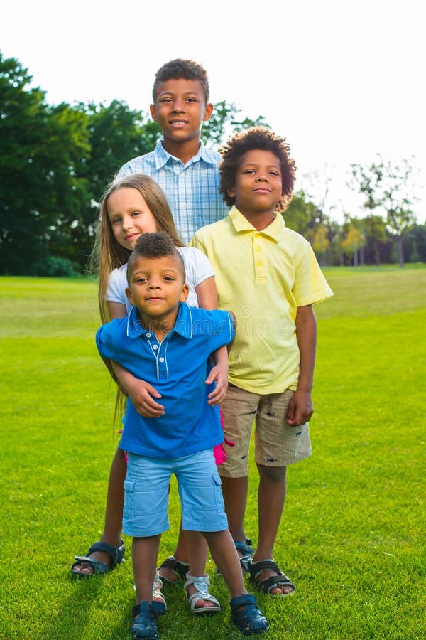 Four Children are Playing on the Glade. Stock Photo - Image of child ...