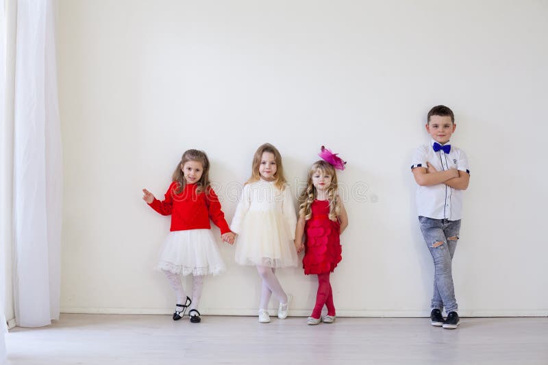 Four Children with Red Balloons in a Bright Holiday Room Stock Image ...