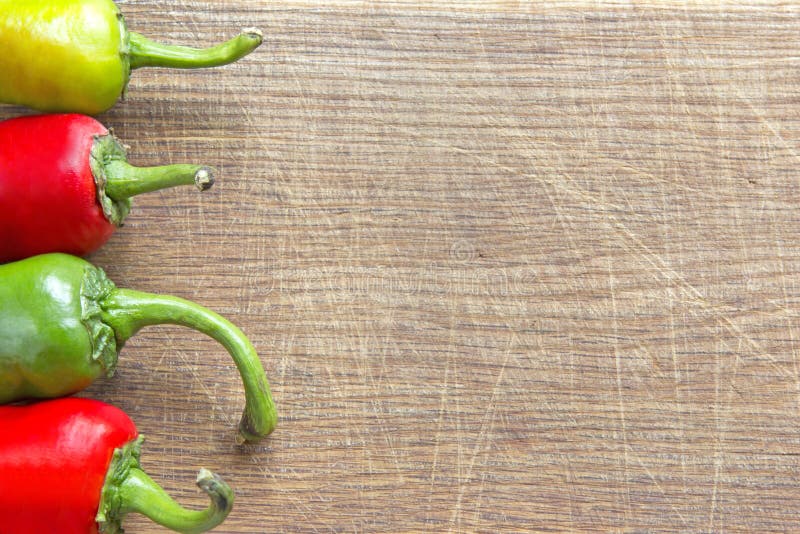 Four chili pepers on board stock photo. Image of fresh - 34156944