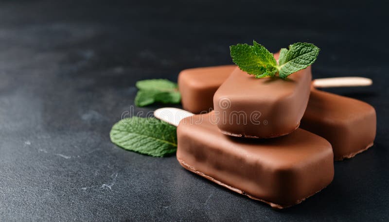 Delicious Glazed Ice Cream Bars and Mint on Black Table. Space for Text ...