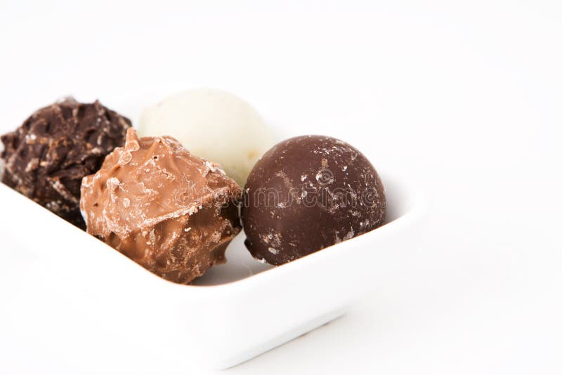 Four chocolate truffles stock photo. Image of background - 2655576