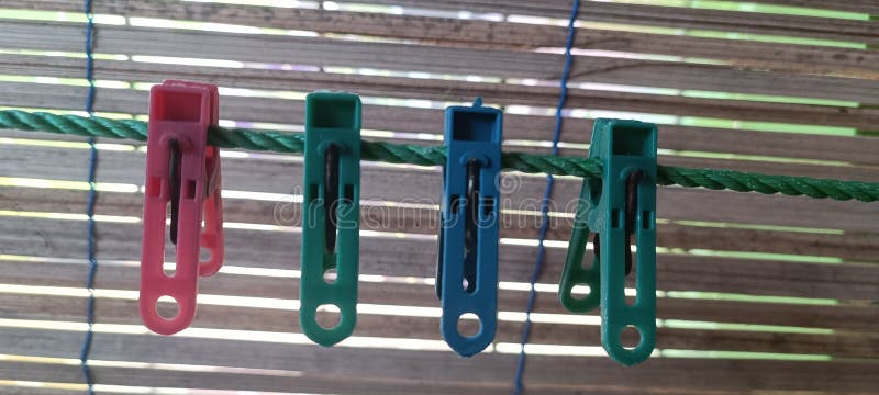 Four Clothes Pins on the Clothesline Stock Image - Image of clothes ...