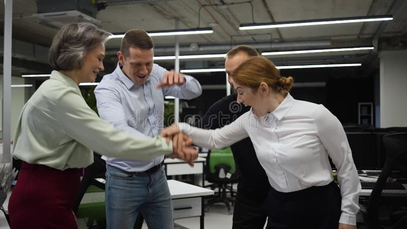 Four Colleagues are Discussing Blueprints in a Conference Room in an ...