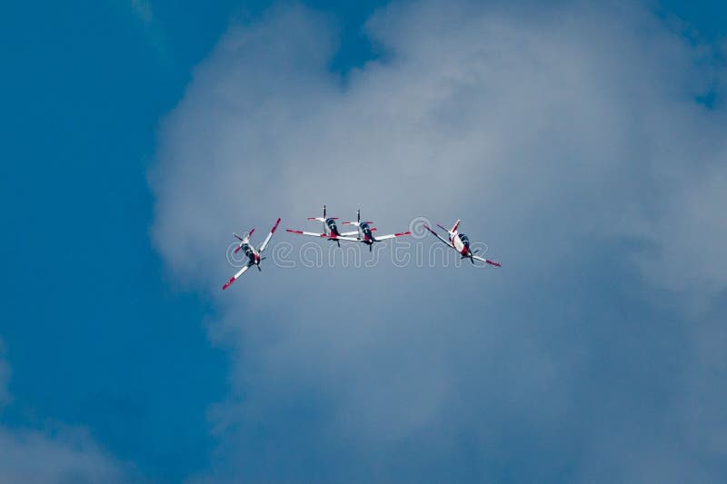 Commercial Aircraft Flying in Formation Against a Backdrop of a Blue ...