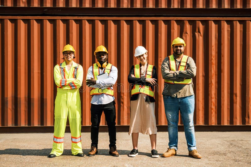 Four Construction Workers Stand Confidently in Front of a Container ...