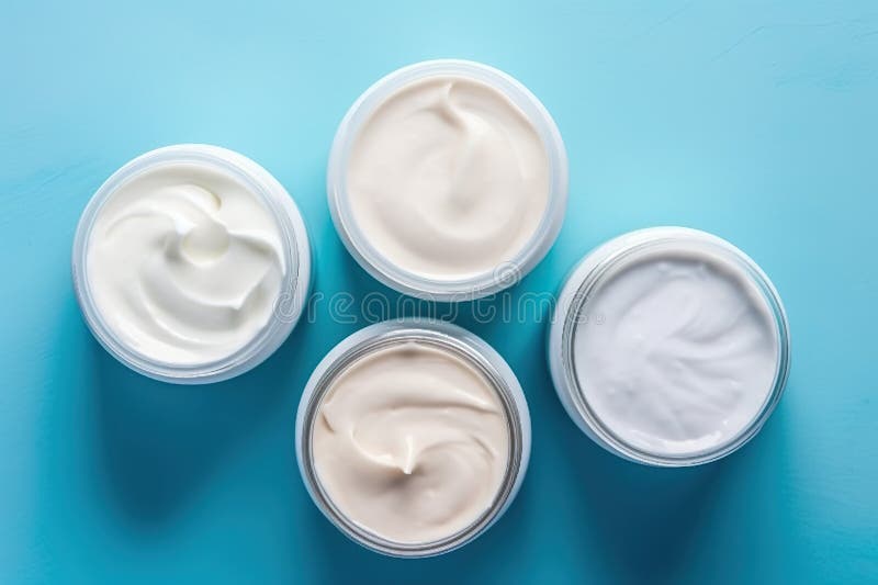 Four Containers of Cream on a Blue Background. AI Generative Image ...