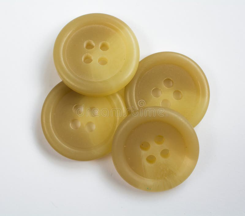 Four Cream Colored Plastic Buttons Stacked and Isolated on White Stock ...