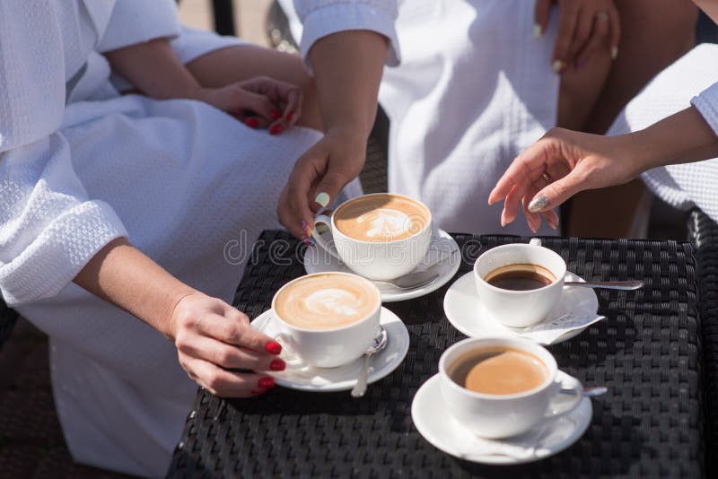 Four Cups with Coffee Stay on the Table Stock Photo - Image of girls ...
