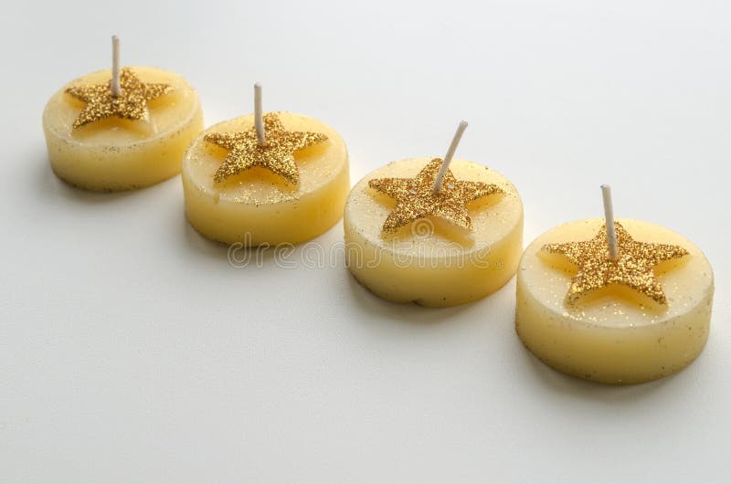 Four Decorative Candles with Star Pattern Stock Photo - Image of ...