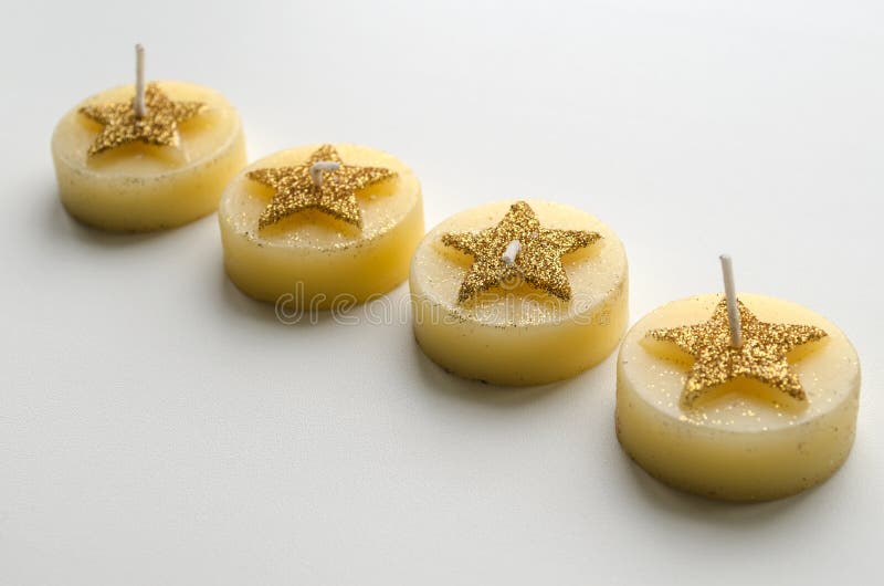 Four Decorative Candles with Star Pattern Stock Photo - Image of four ...