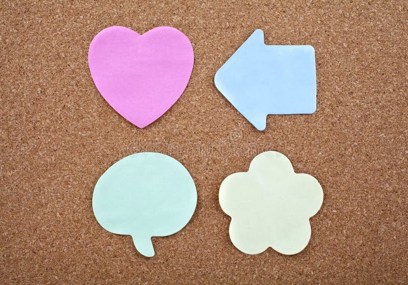 Four Different Sticky Notes on a Notice Board Stock Photo - Image of ...