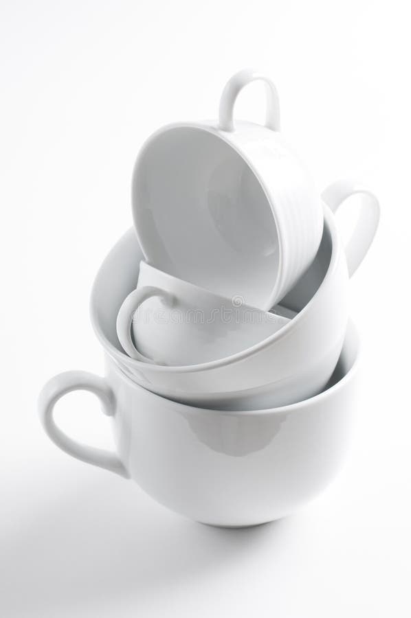 Four different white cups stock image. Image of stack - 22973147