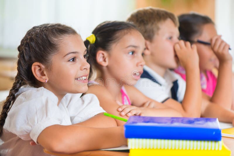 Four Diligent Pupils Studying at Classroom Stock Image - Image of ...