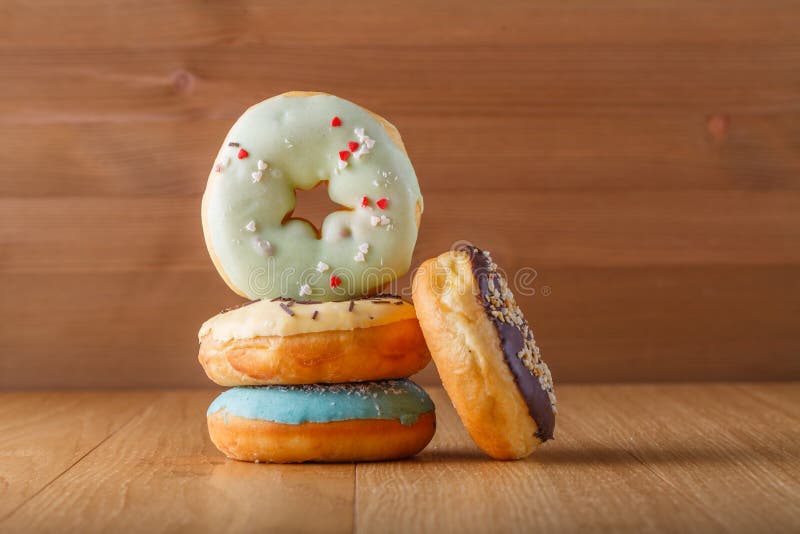 Four donut on table stock photo. Image of snack, icing - 58629878