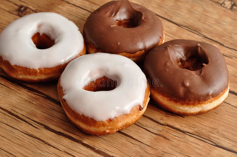 Doughnuts Displayed On A Glass Plate With A Bunch Of Artificial Roses ...