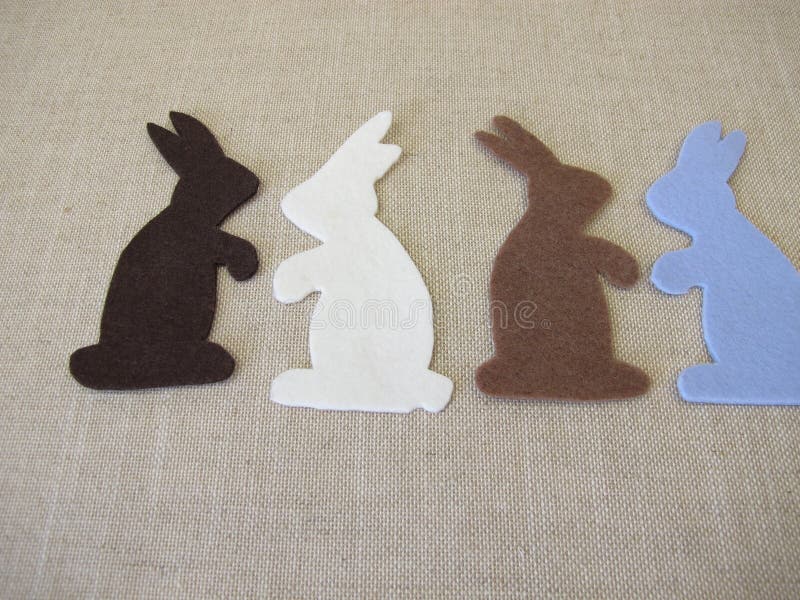 Four Easter Bunnies Cut Out of Colored Felt Stock Photo - Image of ...
