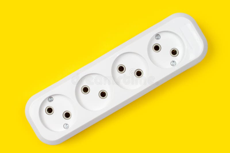 Four Electrical Sockets Made of White Plastic on a Yellow Background ...