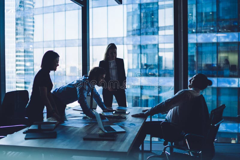 Four Employees Communicating and Discussing Ideas Stock Photo - Image ...