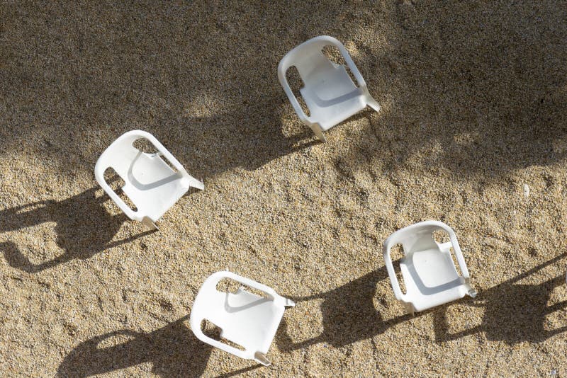 Four Empty Chairs on the Sand Waiting To Be Occupied in a Show Stock ...