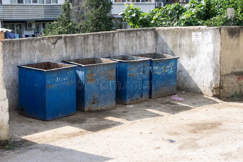 Four Empty Containers for Trash on the Street Stock Image - Image of ...