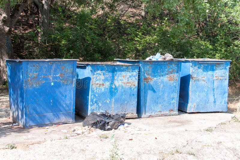 Four Empty Containers for Trash on the Street Stock Photo - Image of ...