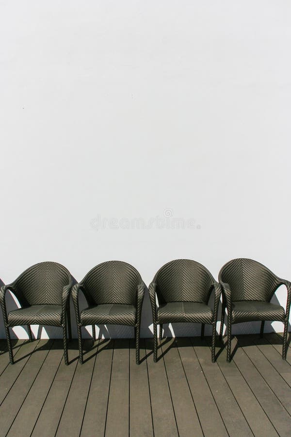 Four Empty Woven Chairs stock photo. Image of gray, floor - 25881686