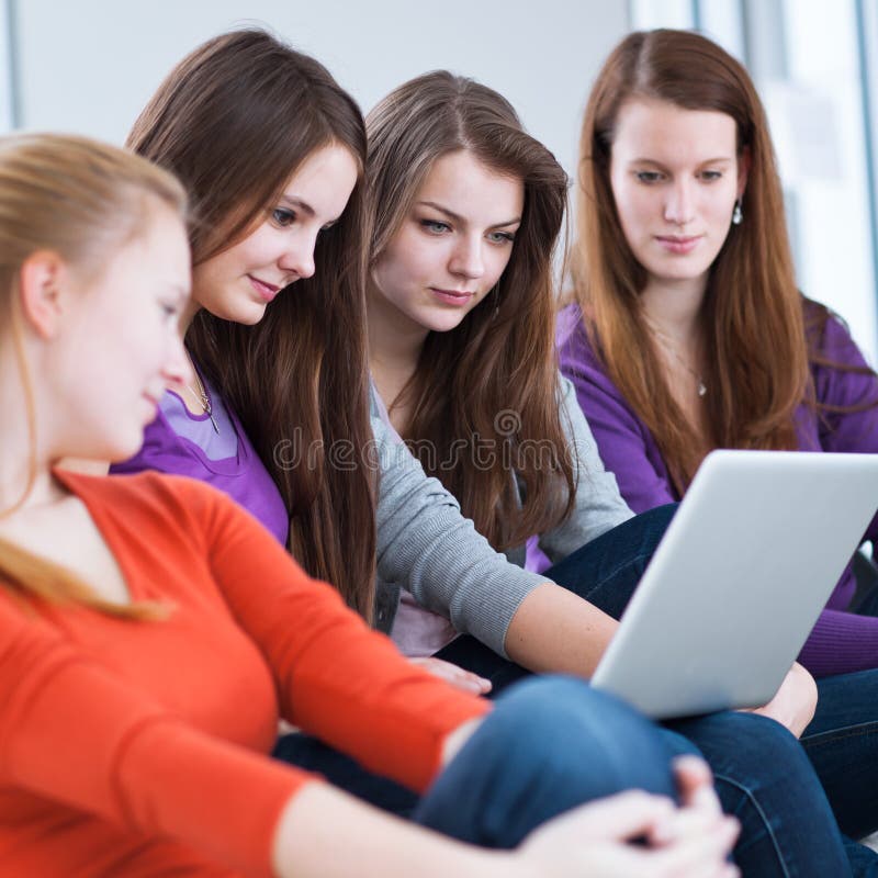 Four Female College Students Using a Laptop Stock Photo - Image of girl ...