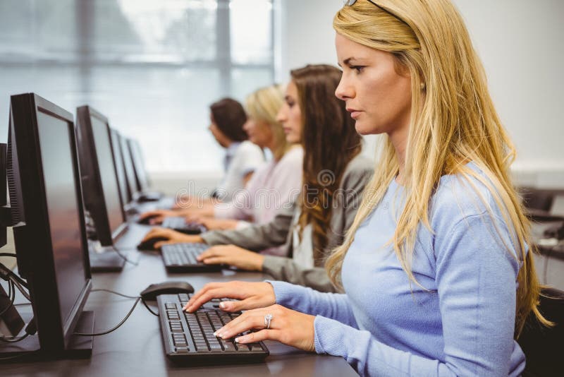 Four Focused Women Working in Computer Room Stock Image - Image of view ...