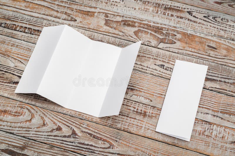 Four - Fold White Template Paper on Wood Texture . Stock Photo - Image ...