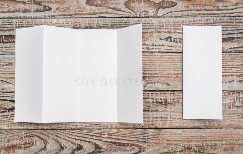 Four - Fold White Template Paper on Wood Texture . Stock Image - Image ...