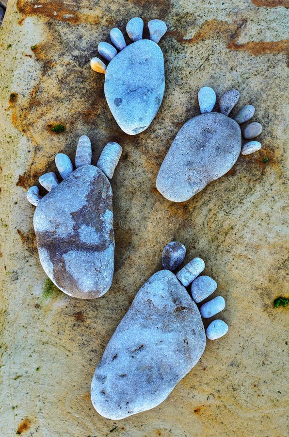 Stone footprints stock image. Image of green, coast, barefoot - 34783235