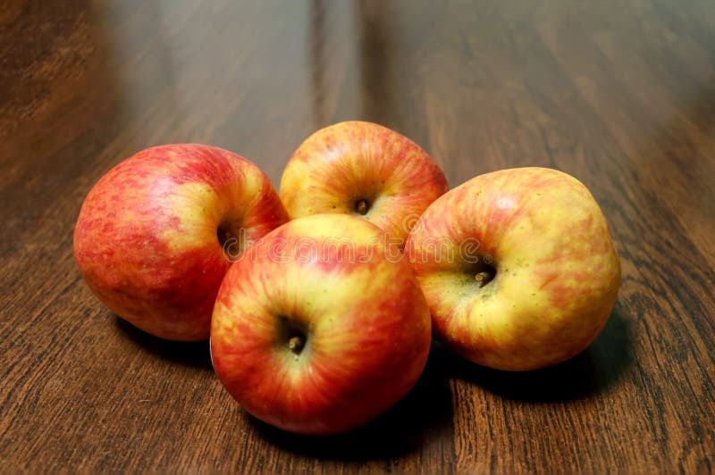 Four Fresh Apples Difference Colors on Wood Table Stock Photo - Image ...