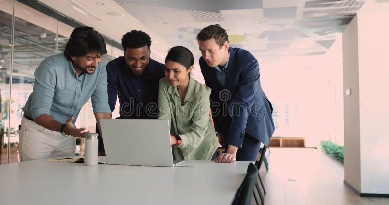 Four Friendly Positive Teammates Working on Project Using Laptop Stock ...
