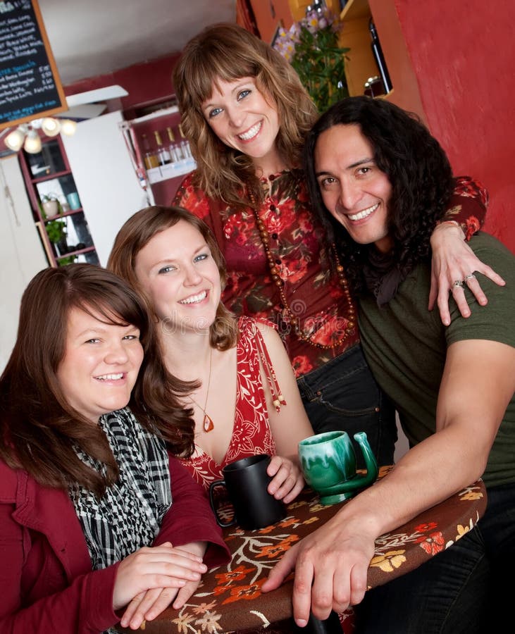 Four Friends Enjoying Dinner At A Restaurant Stock Photo - Image of ...