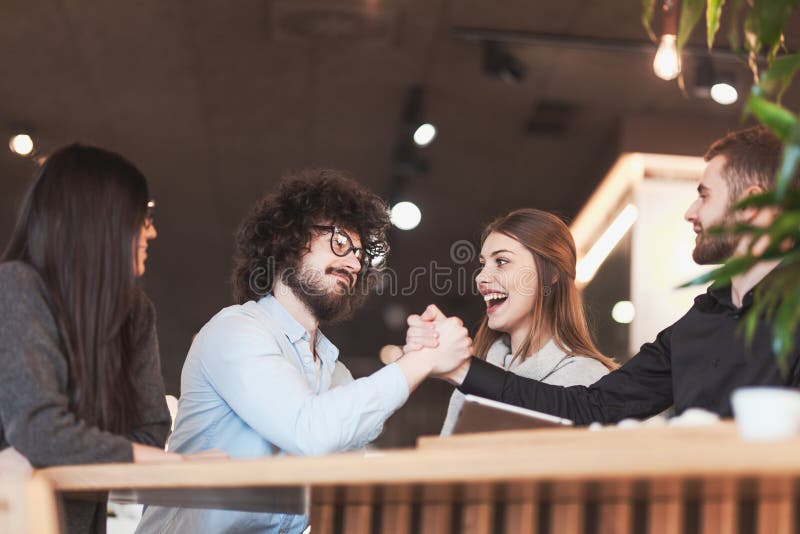 Four Friends at a Cafe Having Fun and Celebrating. Successful Young ...