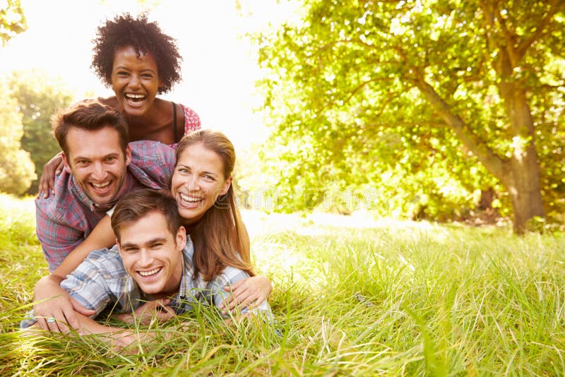 Four Friends Having Fun Together in the Countryside Stock Image - Image ...