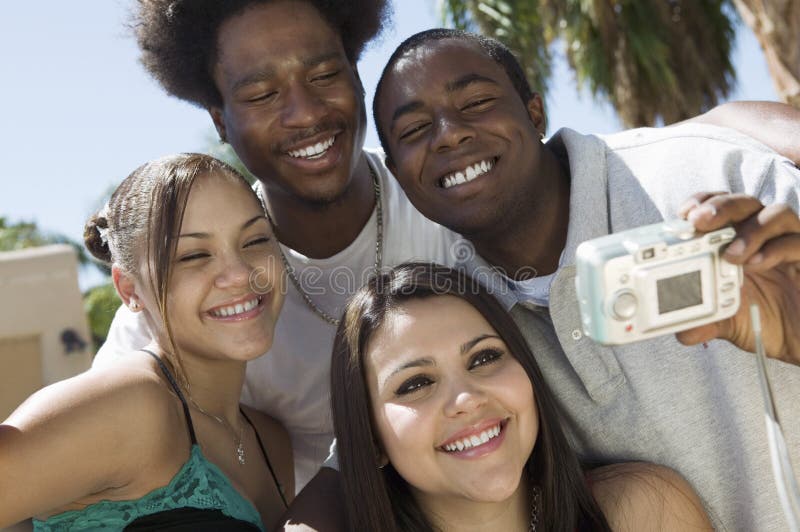 Four Friends Photographing Selves Stock Image - Image of cheerful ...