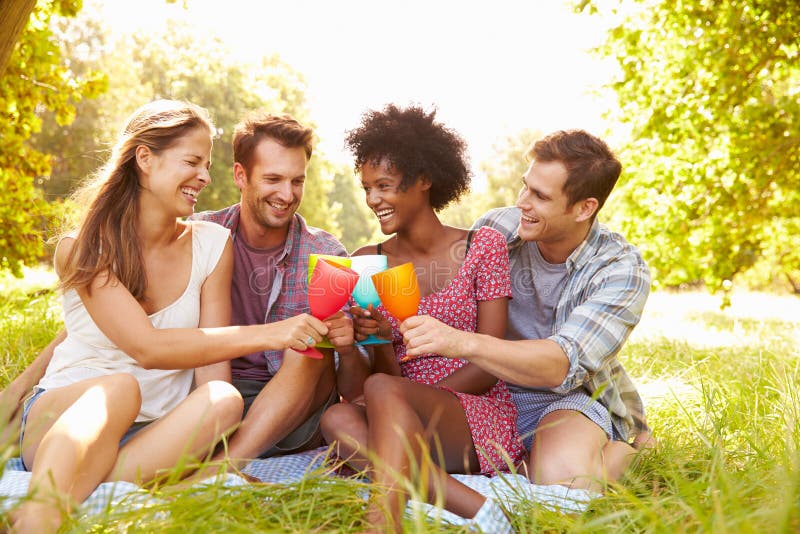Four Friends Relax Together Drinking Countryside Stock Photos - Free ...