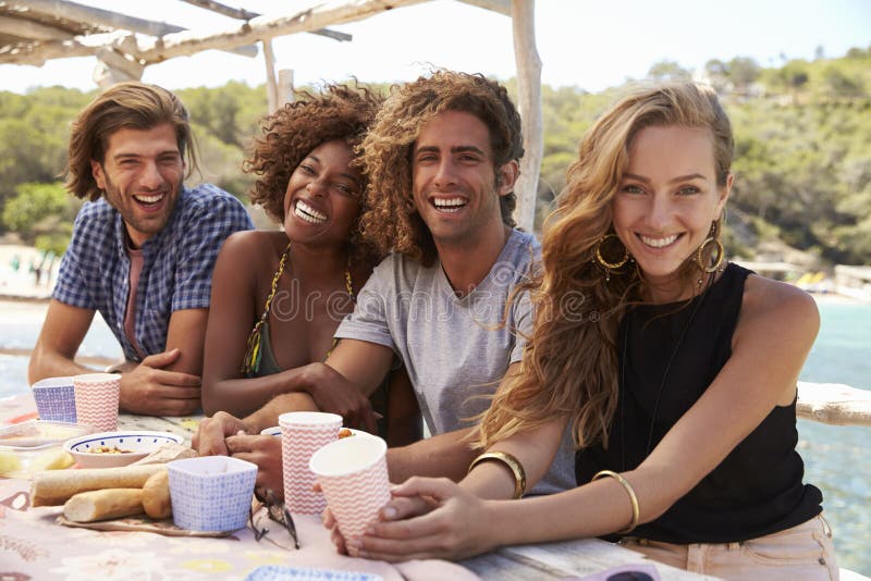Two Couples Drinking on the Beach, Backlit, Close Up, Ibiza Stock Photo ...