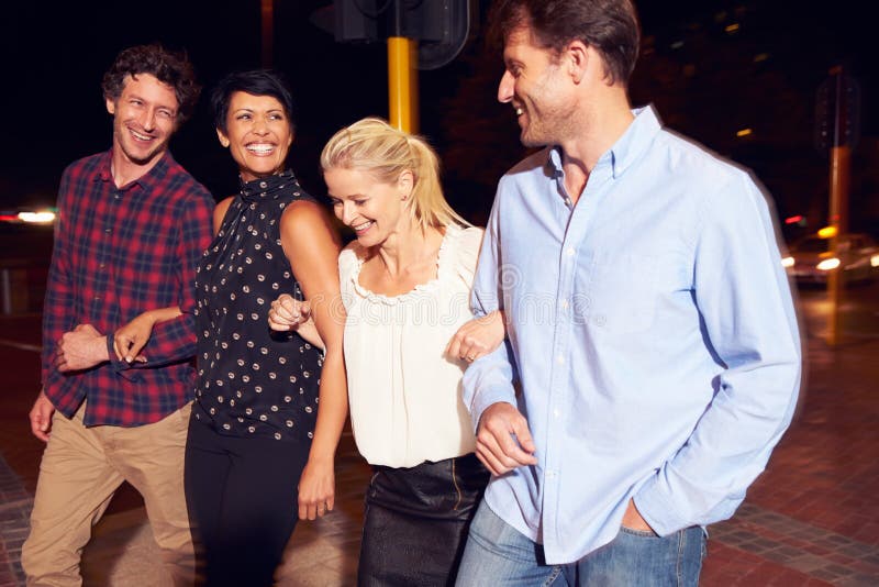 Four Friends Walking Town Together Night Stock Photos - Free & Royalty ...