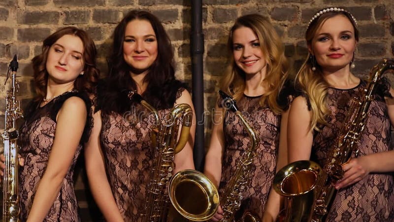Four Girls Ensemble Smiles Near Brick Wall with Stock Video - Video of ...