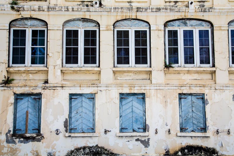 Four Glass and Four Shuttered Windows Stock Photo - Image of building ...