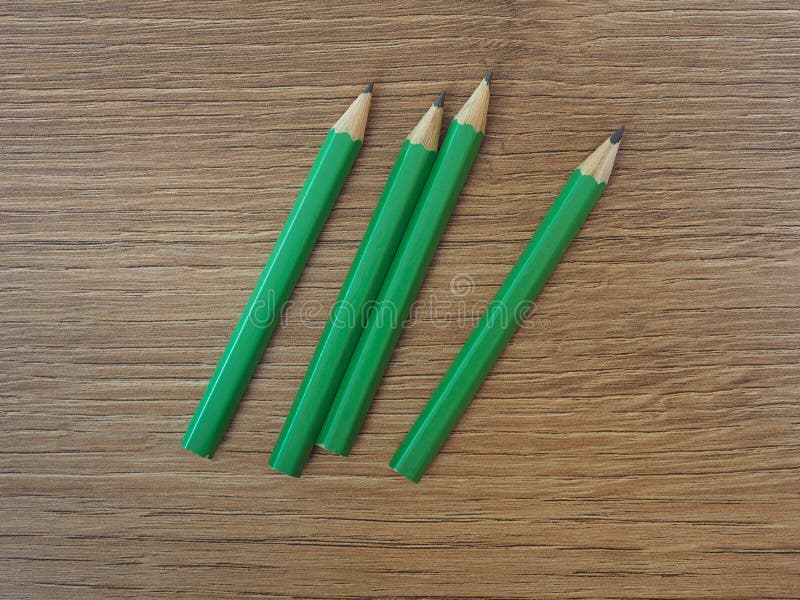 Four green pencils stock image. Image of desk, stationery - 261584893