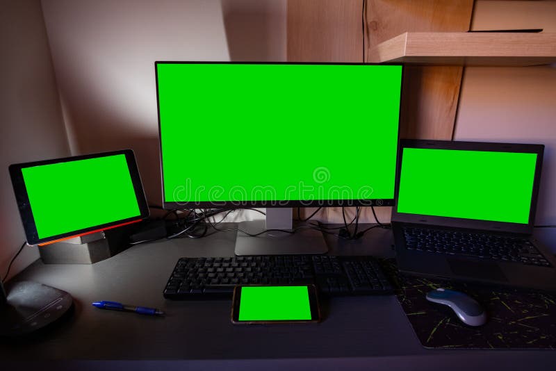 Four Green Screens on the Desktop Stock Photo - Image of microstock ... Four Green Screens on the Desktop Stock Photo - Image of microstock ...
