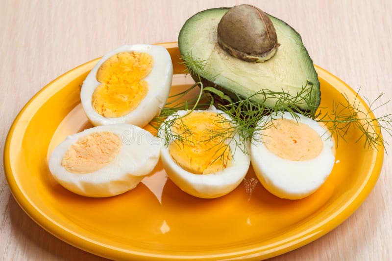 Half Cooked Eggs and Avocado Stock Photo - Image of groceries, plate ...
