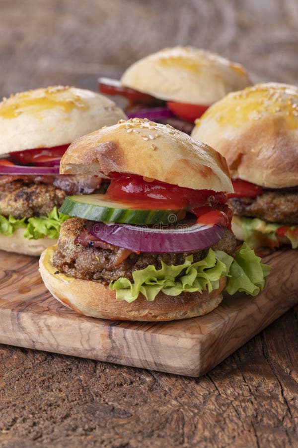 Four hamburgers stock image. Image of cooking, fast - 145312787